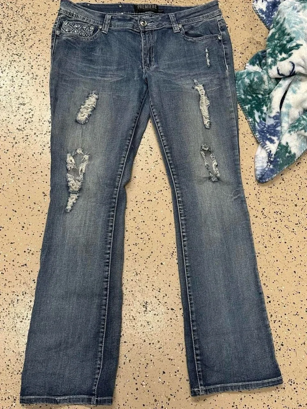 Premier | Jeans | Ripped Blue Low Rise Jeans With A Flared Leg | Poshmark